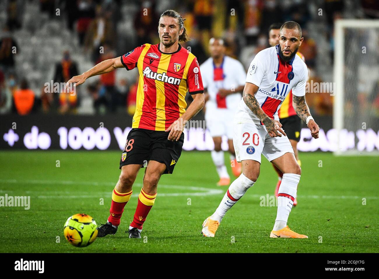 Yannick CAHUZAC of Lens and Layvin KURZAWA of PSG during the French ...