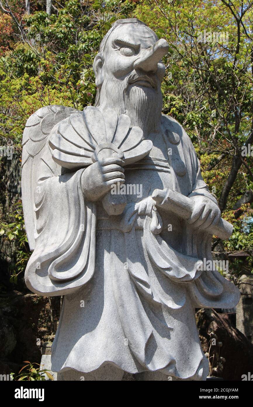 statue of a divinity (tengu) in a buddhist and shinto temple (daisho-in ...