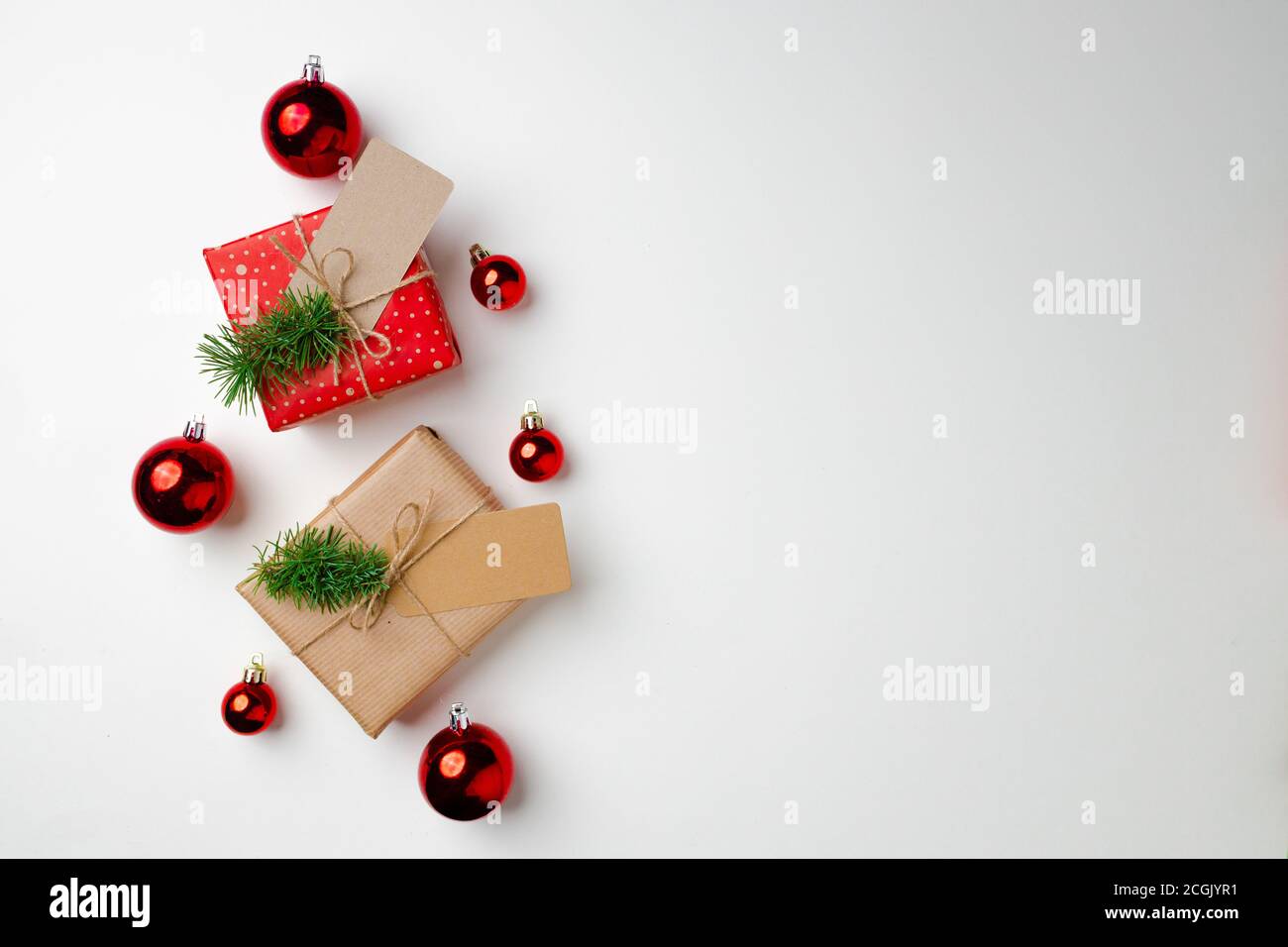 Wrapped gifts and Christmas baubles on white background Stock Photo - Alamy