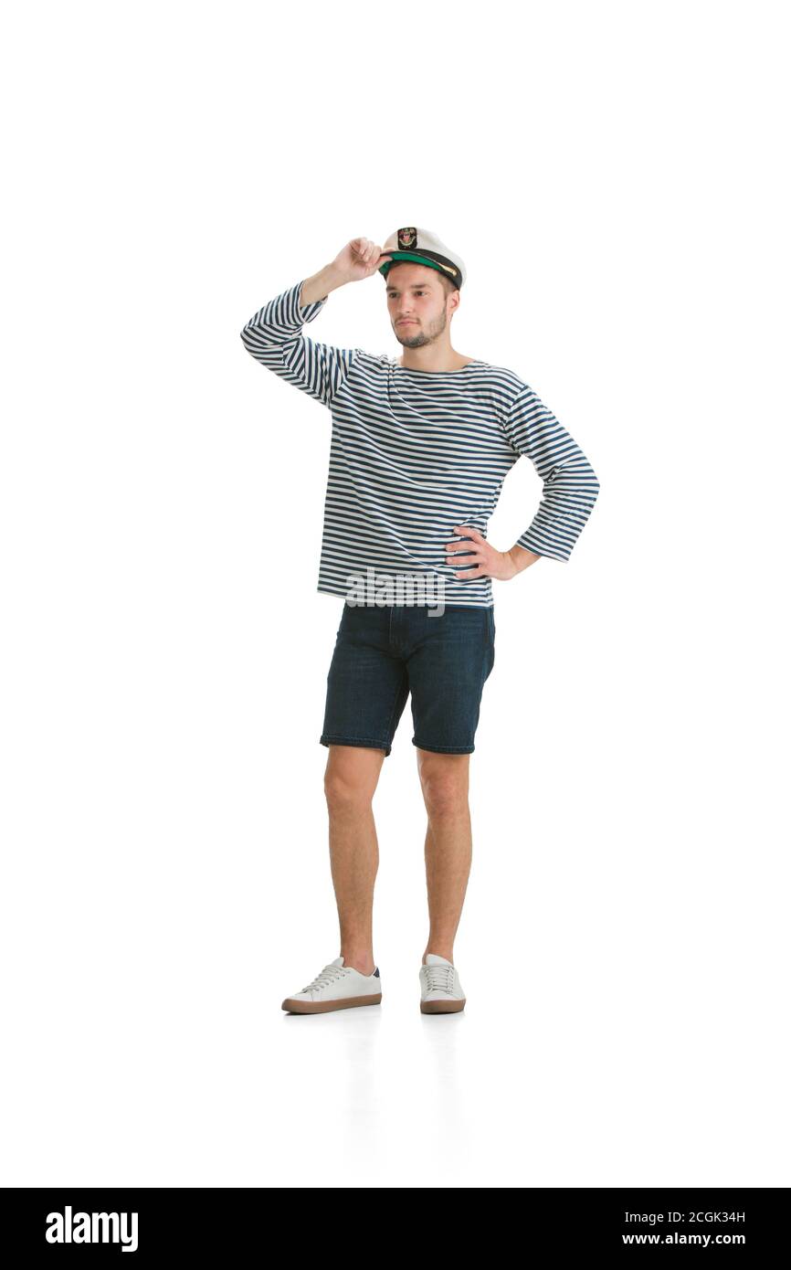 Confident posing. Caucasian male sailor in uniform on white studio ...