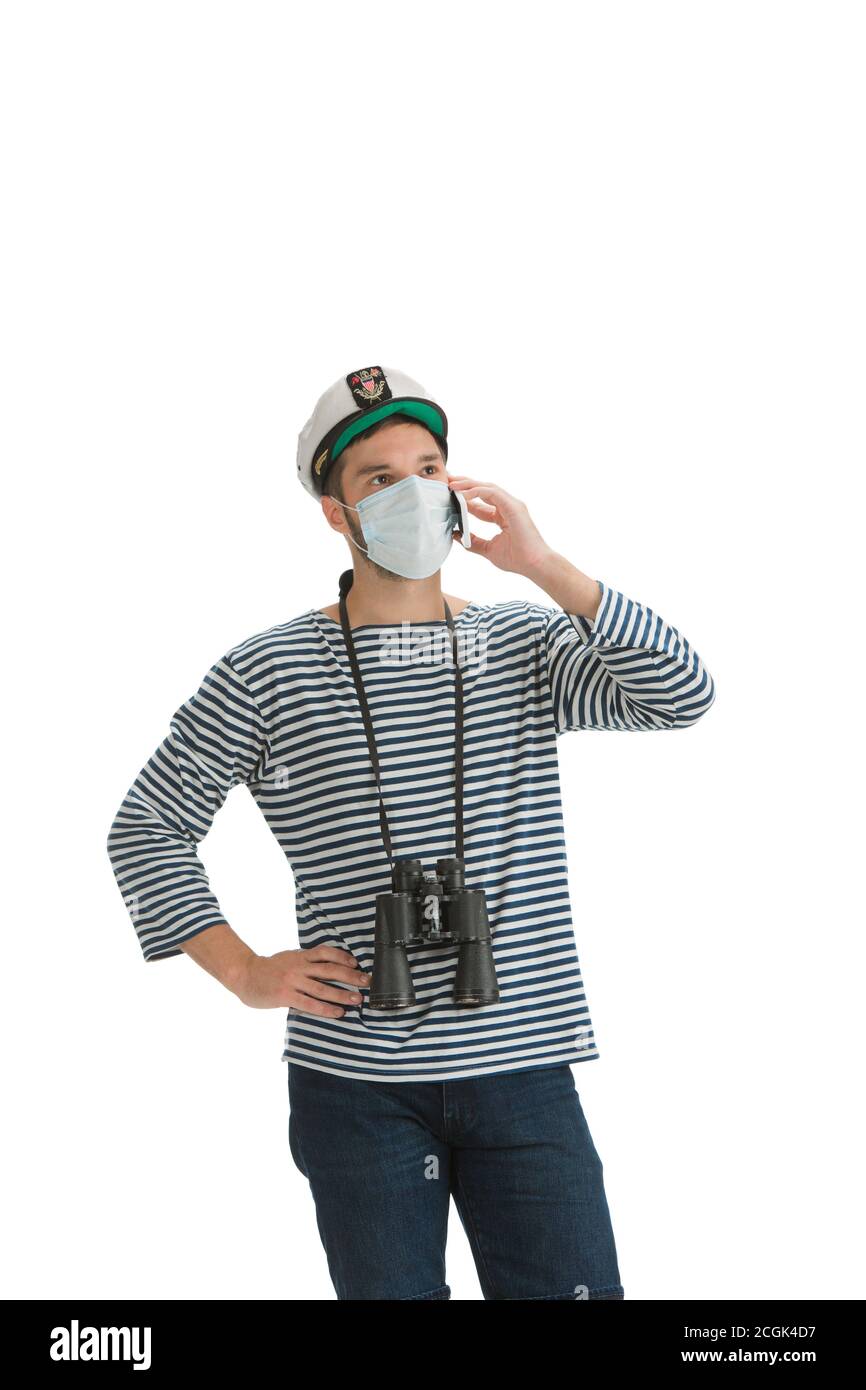 Talking phone. Caucasian male sailor in uniform on white studio ...