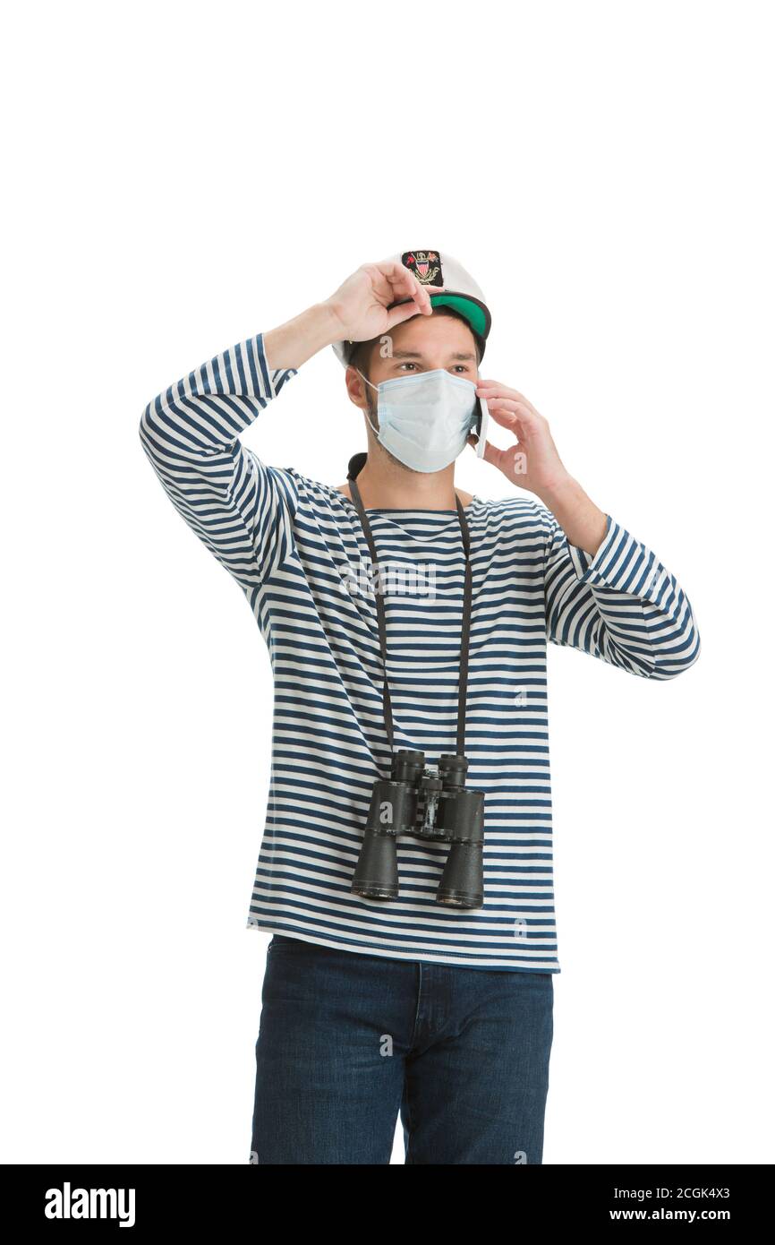 Talking phone. Caucasian male sailor in uniform on white studio ...