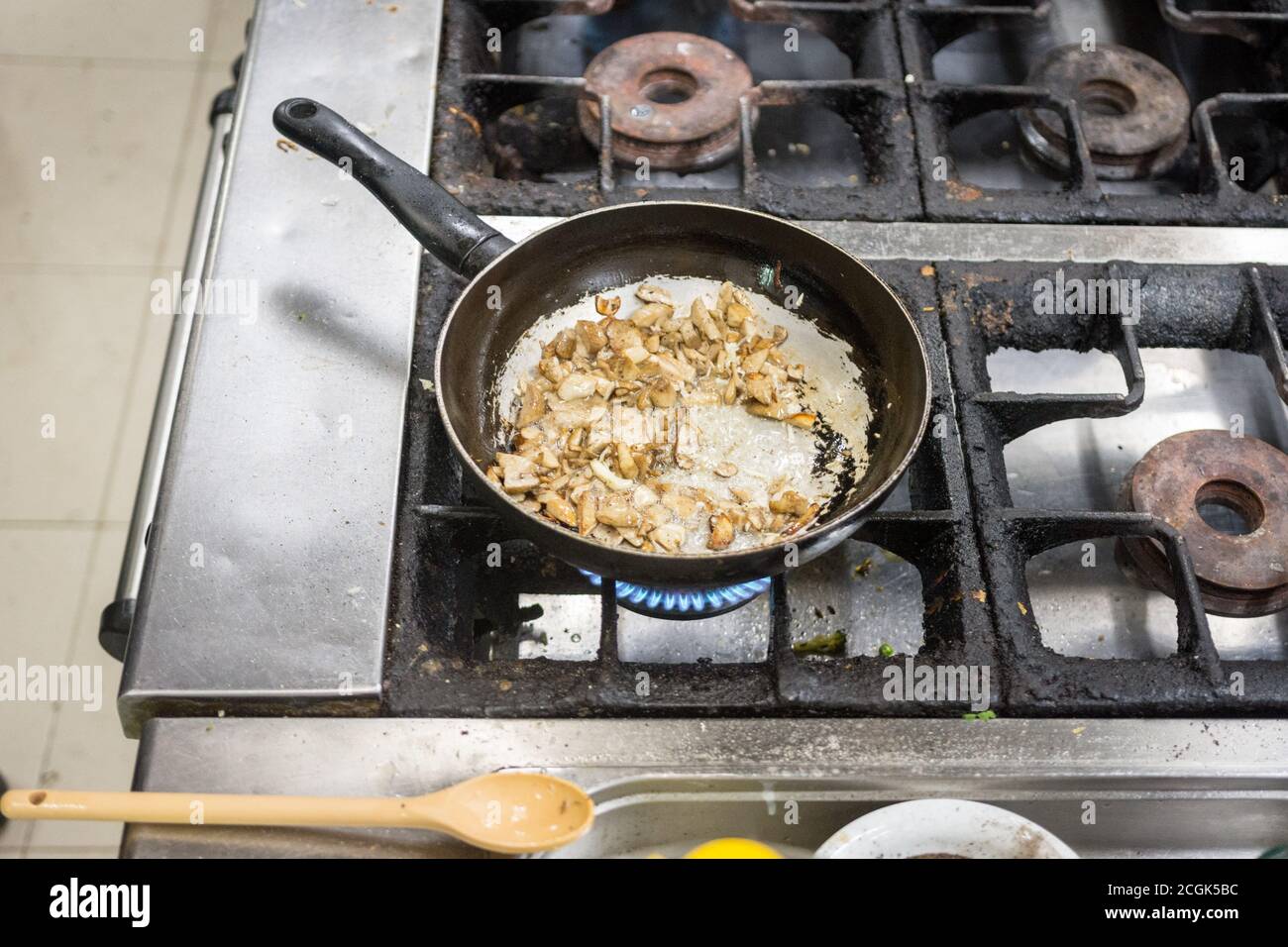Cooking something delicious in a pan Stock Photo - Alamy