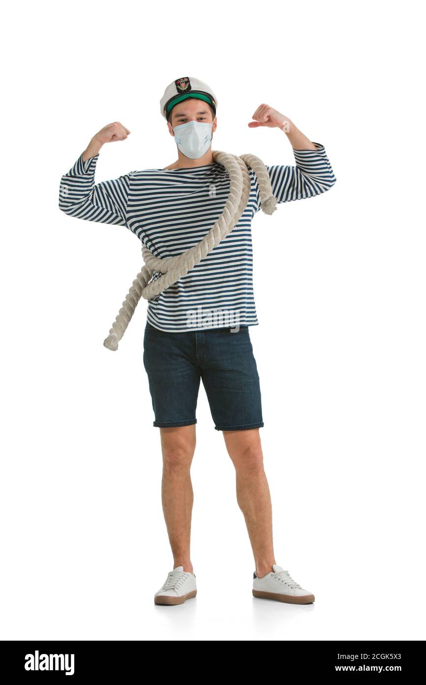 Strong, healthy. Caucasian male sailor in uniform on white studio ...