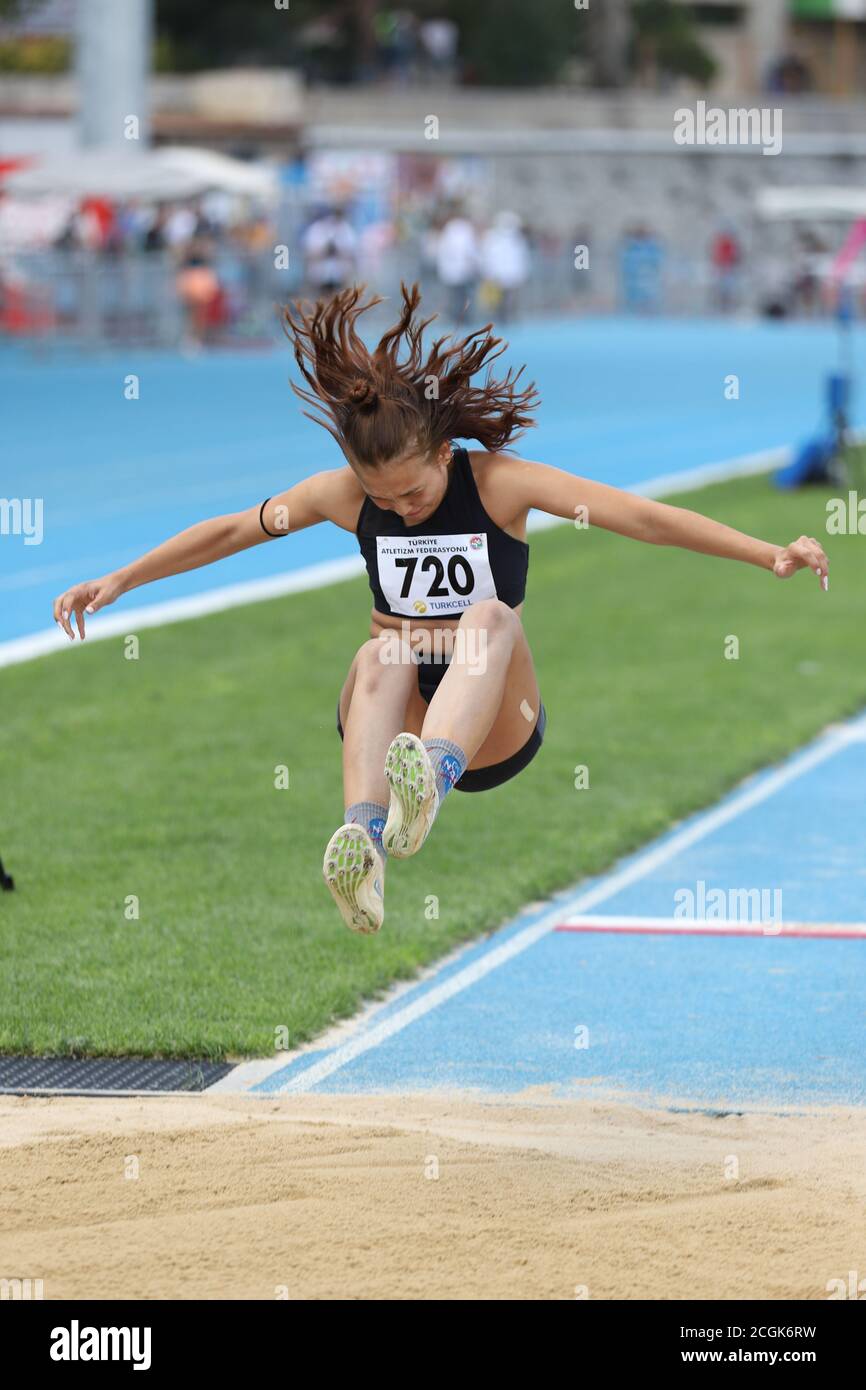 ISTANBUL, TURKEY - SEPTEMBER 05, 2020: Undefined athlete long jumping ...