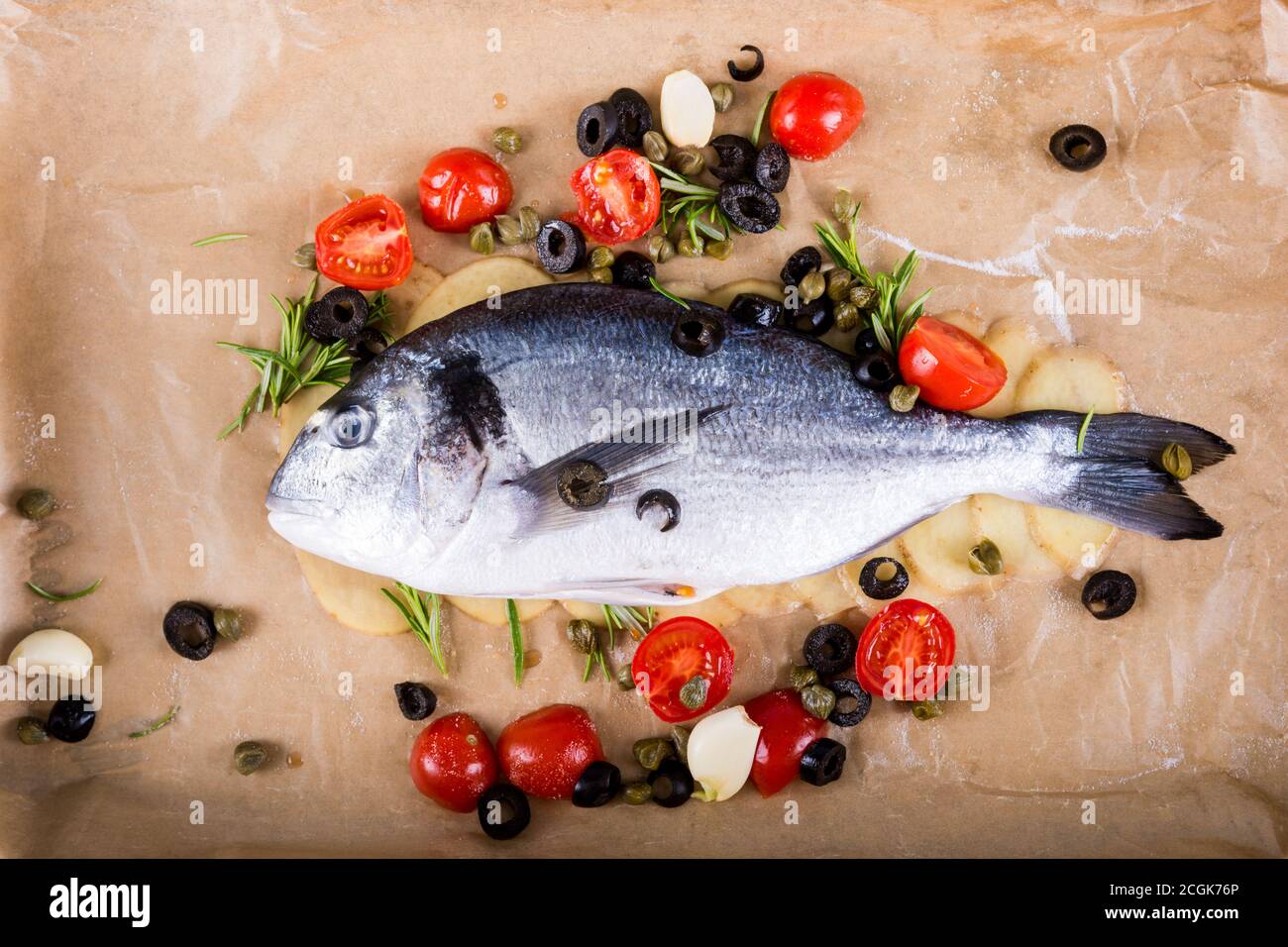 Baked fish served in a fish dish Stock Photo - Alamy