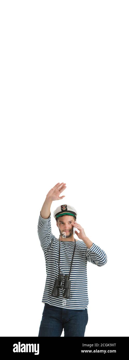 Man with smartphone. Caucasian male sailor in uniform on white studio ...