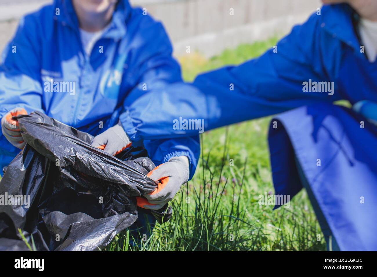 Team group of young people, girls and boys volunteering and participate ...