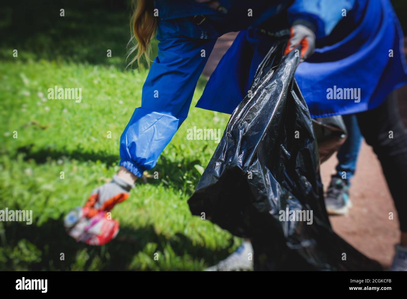 Team group of young people, girls and boys volunteering and participate ...