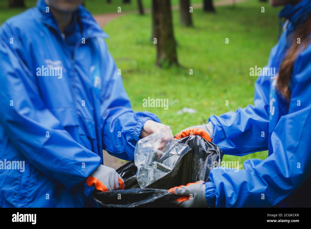 Team group of young people, girls and boys volunteering and participate ...