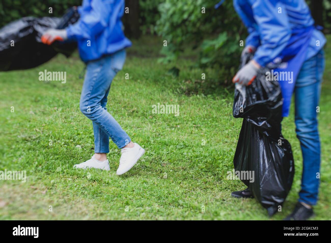 Team group of young people, girls and boys volunteering and participate ...