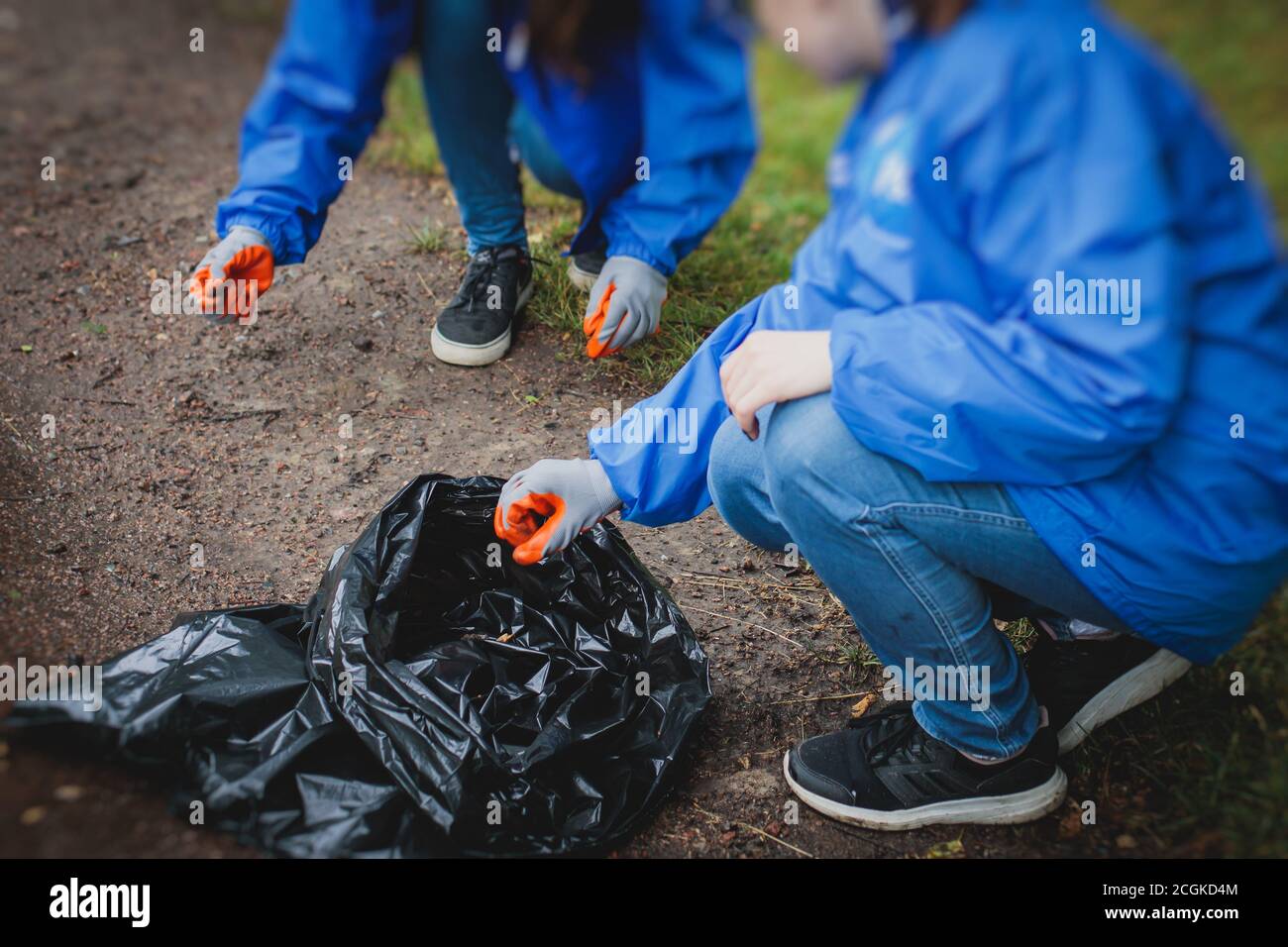 Team group of young people, girls and boys volunteering and participate ...