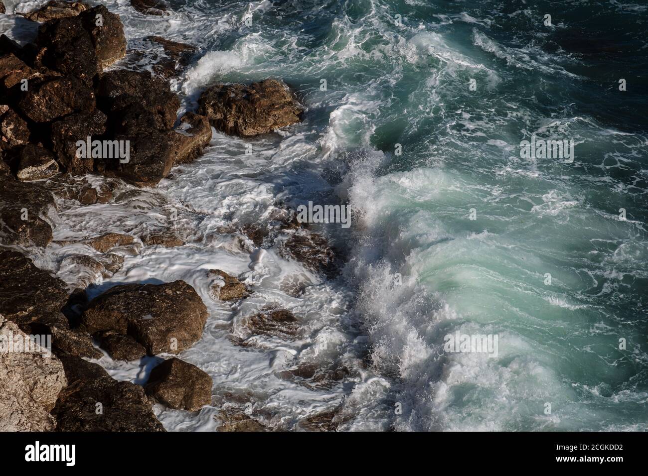 Ocean wave background breaking sea water rocky shore rough seas ...