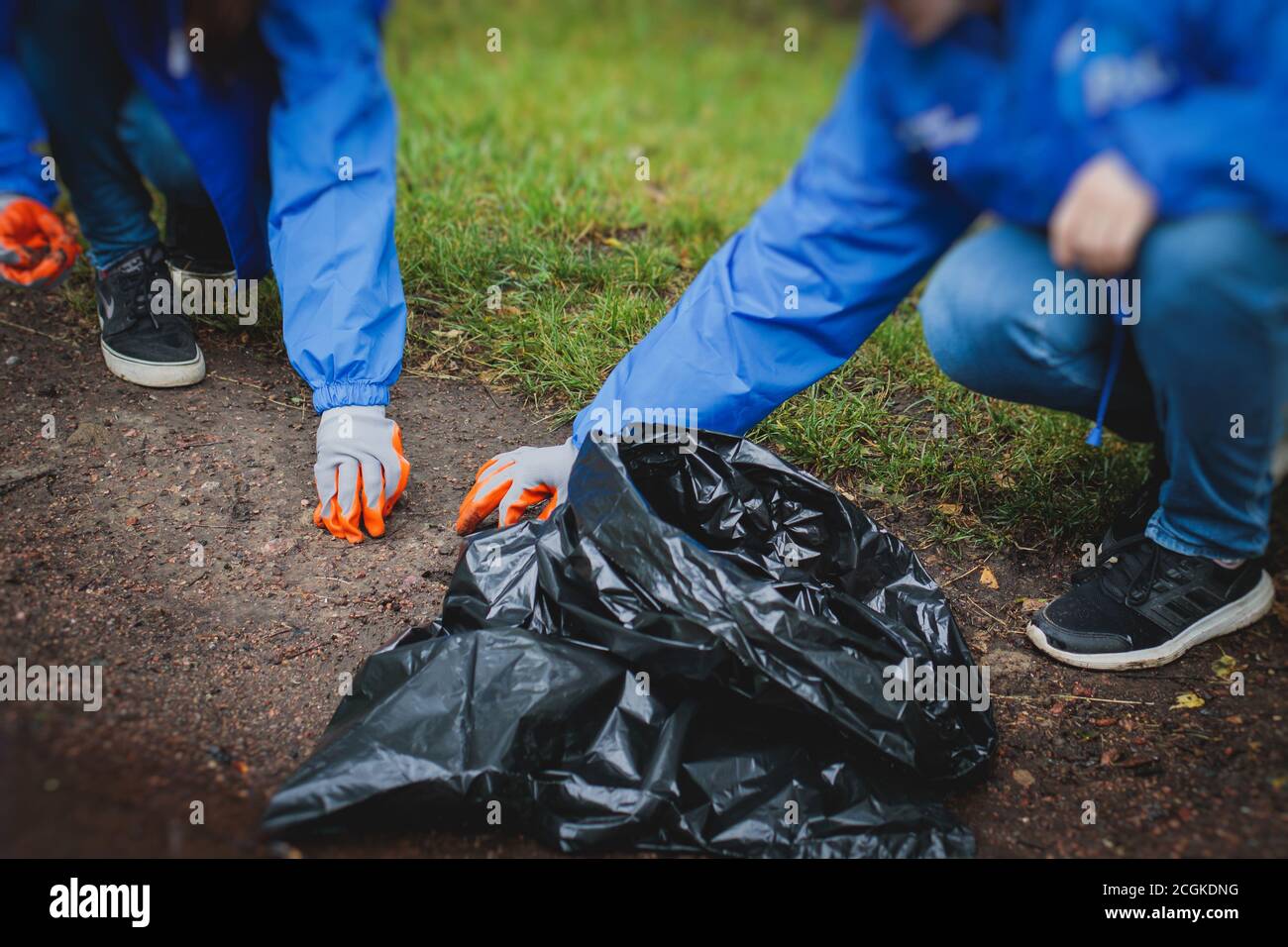 Team group of young people, girls and boys volunteering and participate ...