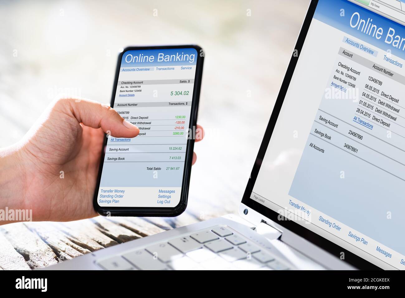 Online Banking Balance On Mobile Phone And Laptop Stock Photo - Alamy