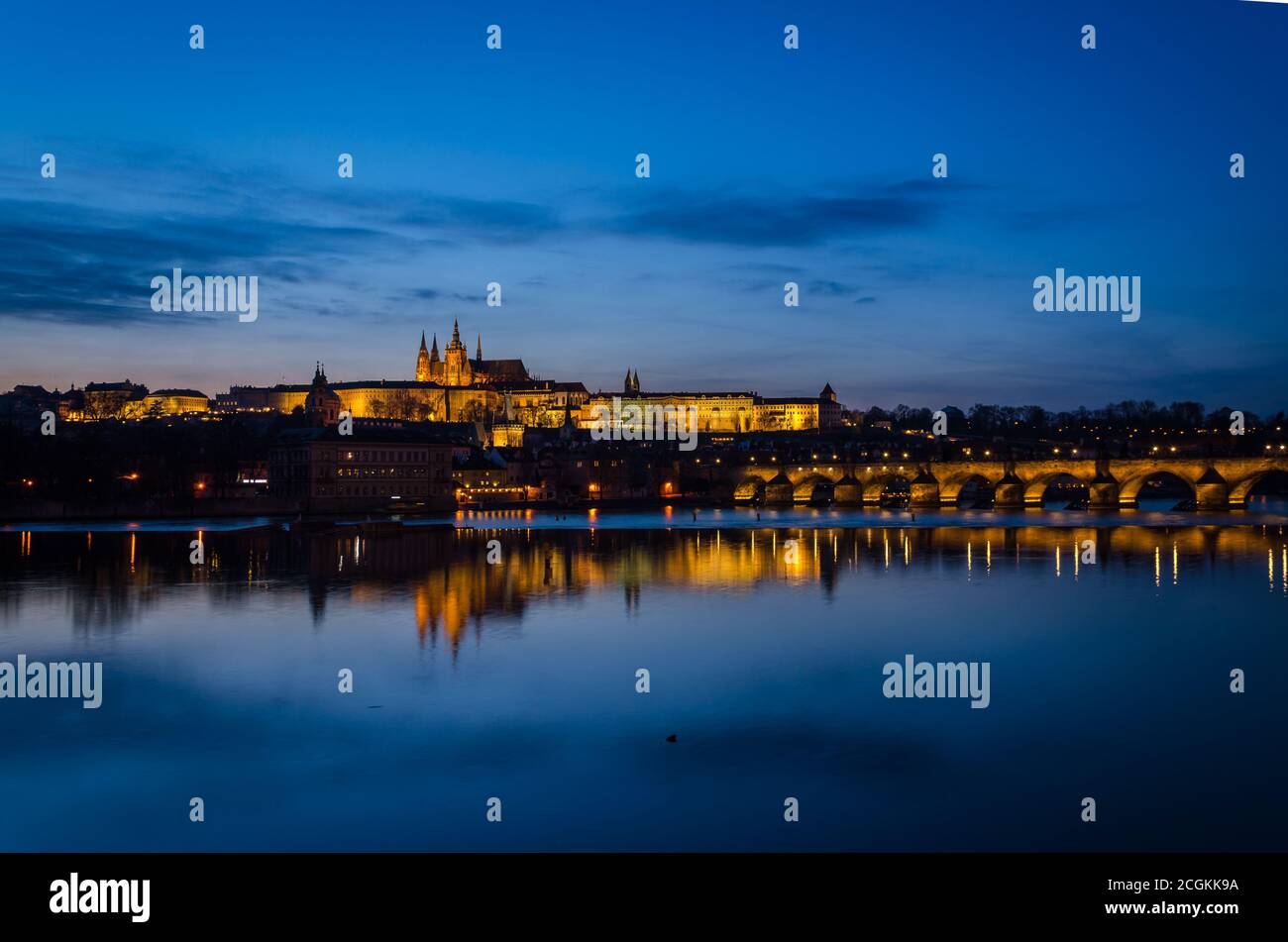 Night view of Prague at blue hour with the lights reflected on the ...