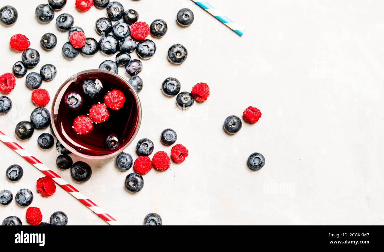 Berry drink with blueberry and raspberry, striped straw, top view Stock ...