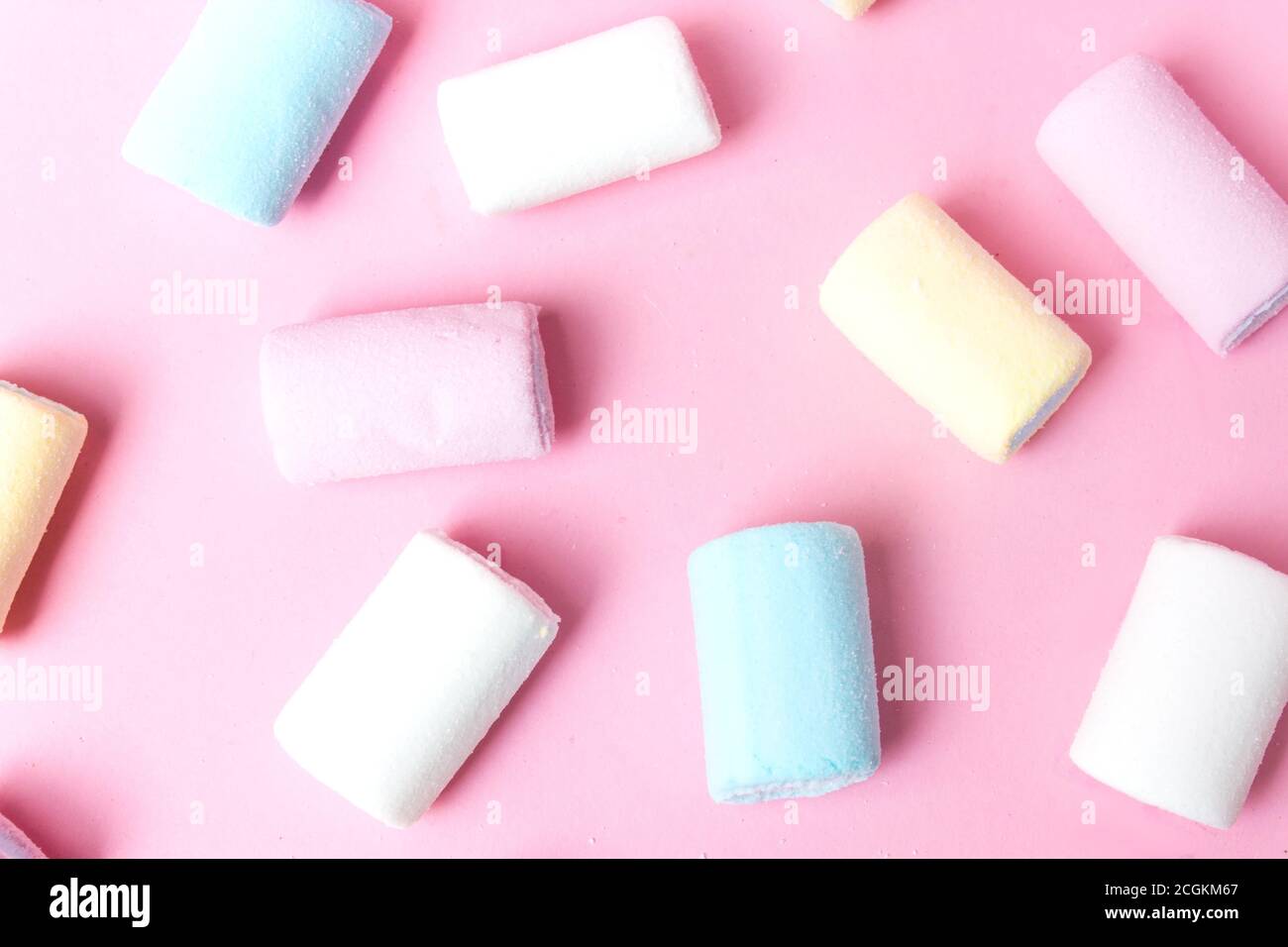Colorful marshmallows placing on pink flatlay. Marshmallow pastel ...