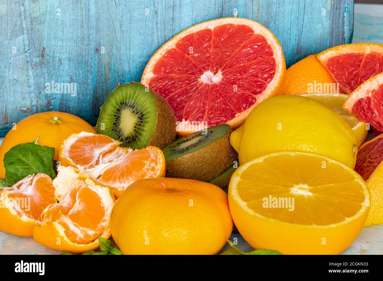 citrus fruit on a blue background Stock Photo - Alamy