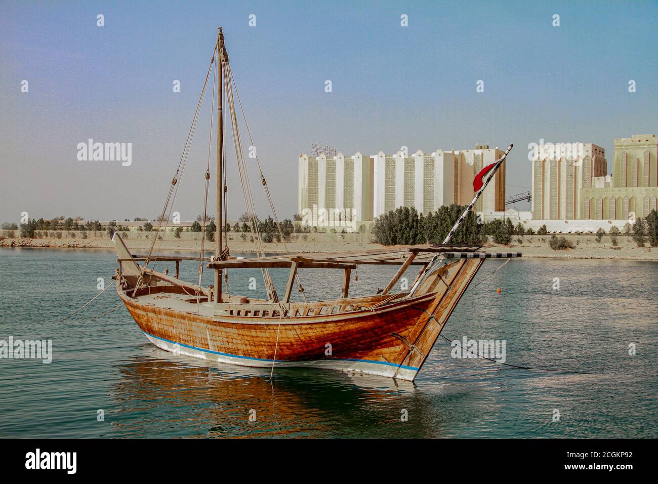 Traditional boats called Dhows are anchored in the port near Museum of ...