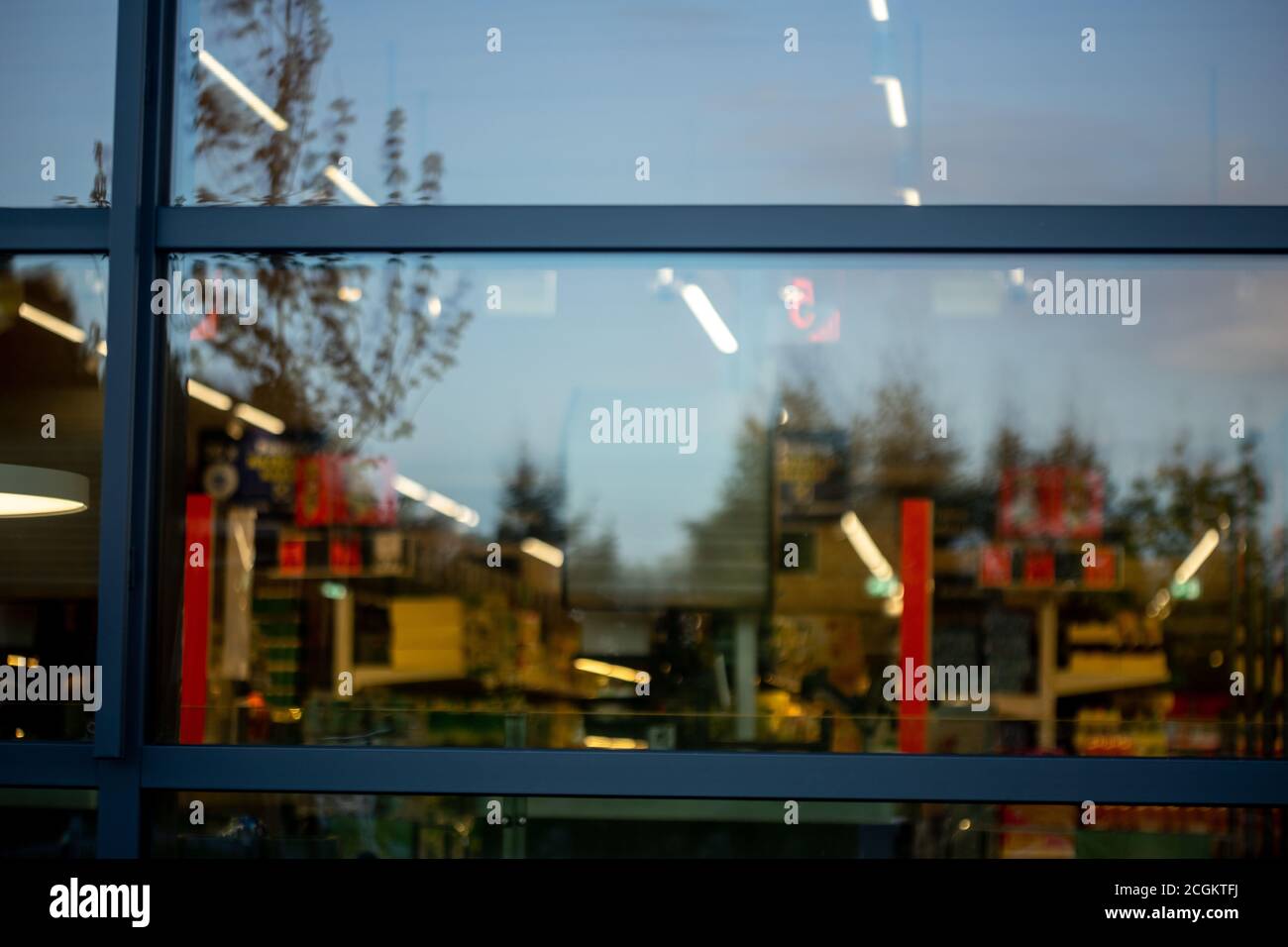 supermarket store windows with lights and advertisements inside Stock ...