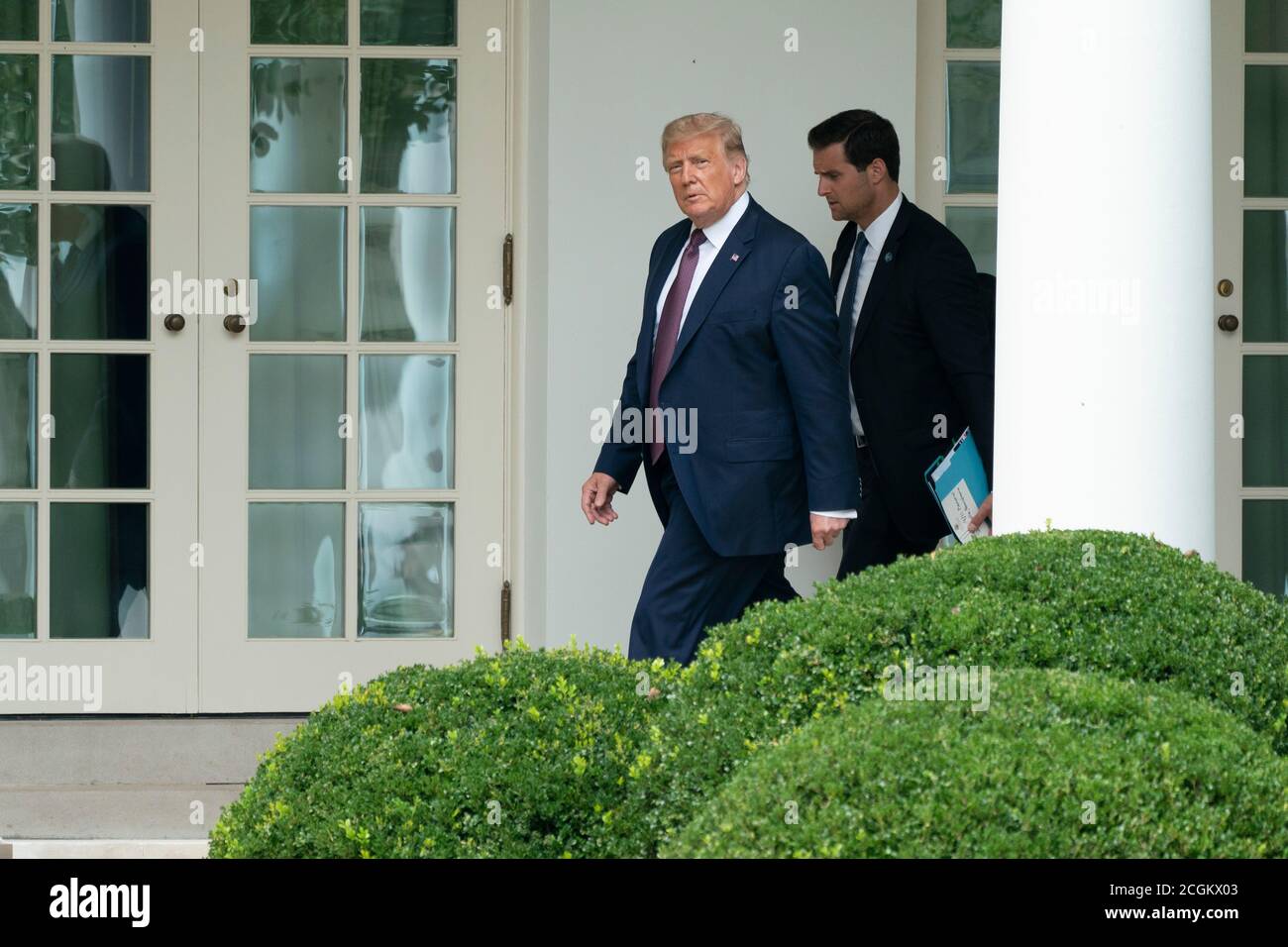 United States President Donald J. Trump walks to the Oval Office with ...