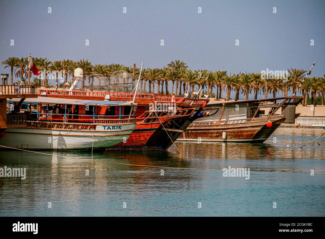 Traditional boats called Dhows are anchored in the port near Museum of ...