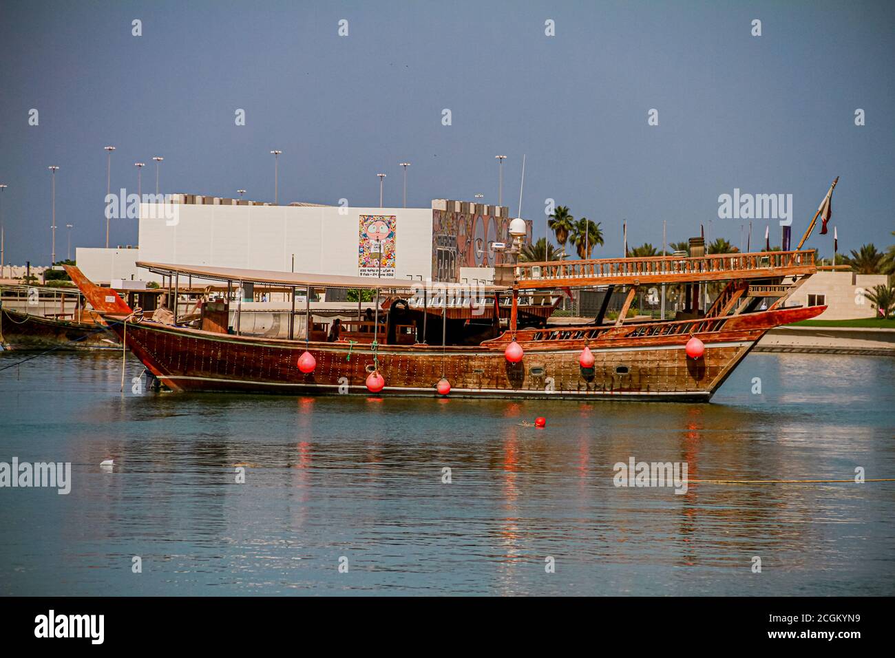 Traditional boats called Dhows are anchored in the port near Museum of ...
