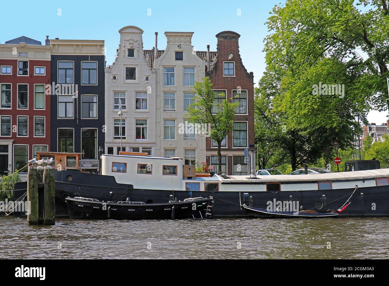 Vintage architecture house with closed windows facade on canal in ...