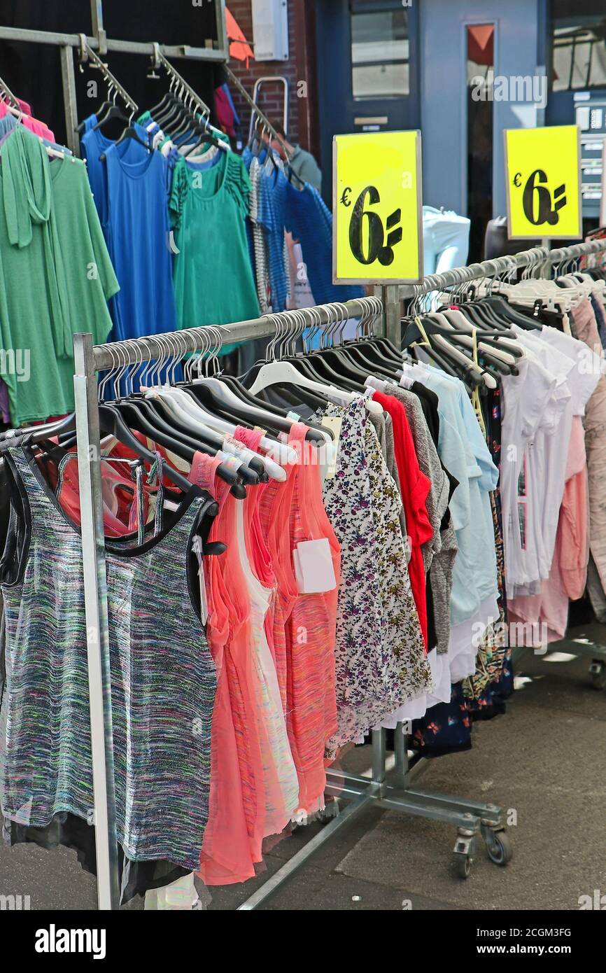 Fashionable colorful shirts sold on outside market stall Stock Photo ...