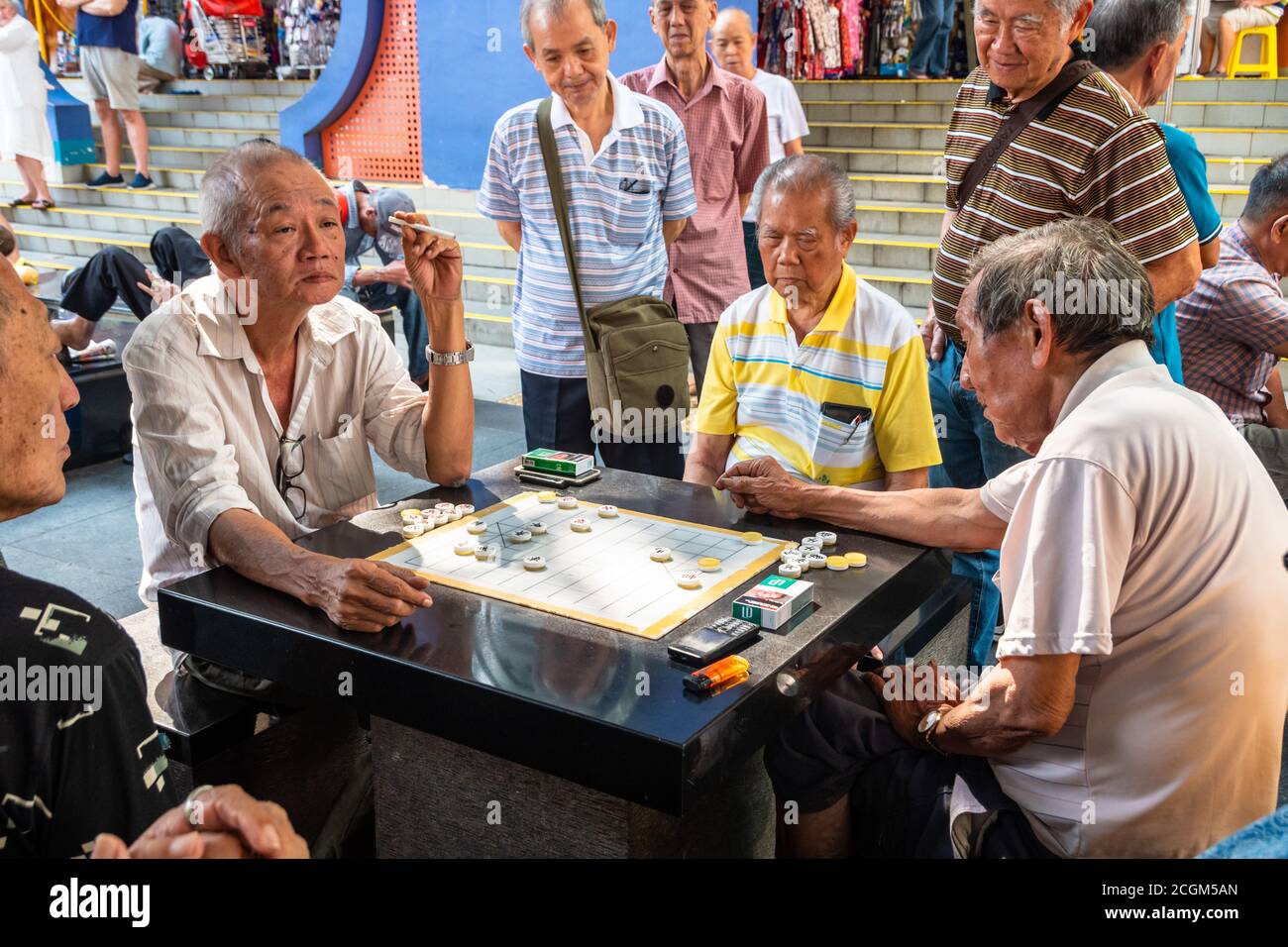 Chinatown, Singapore - 11 2018: Old men playing Xiangqi, chinese chess ...