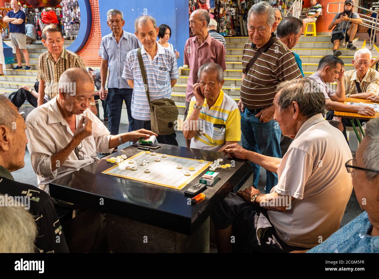 Chinatown, Singapore - 11 2018: Old man playing Xiangqi, chinese chess ...