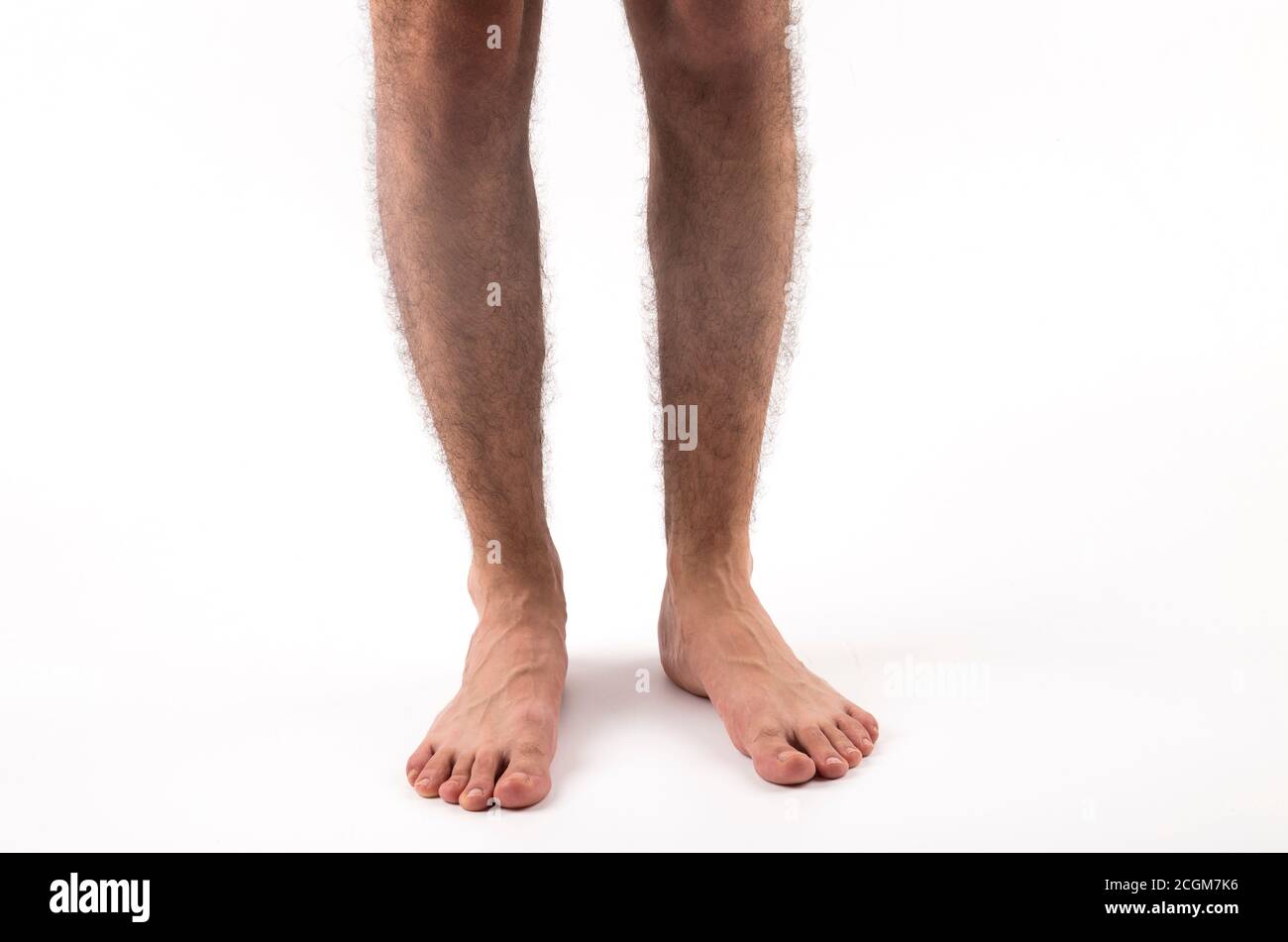 male legs isolated white background Stock Photo - Alamy
