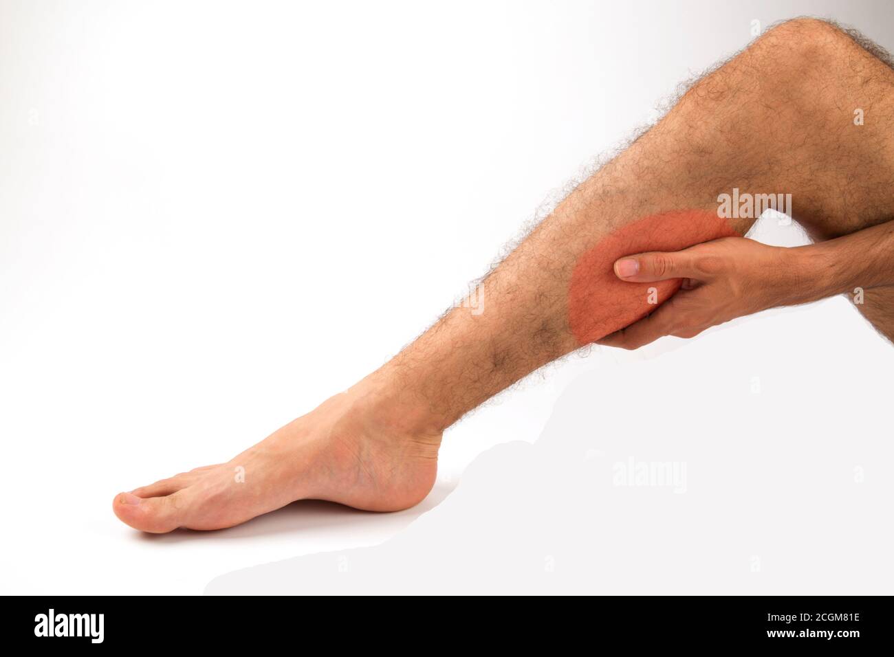 aching male leg on white background Stock Photo - Alamy