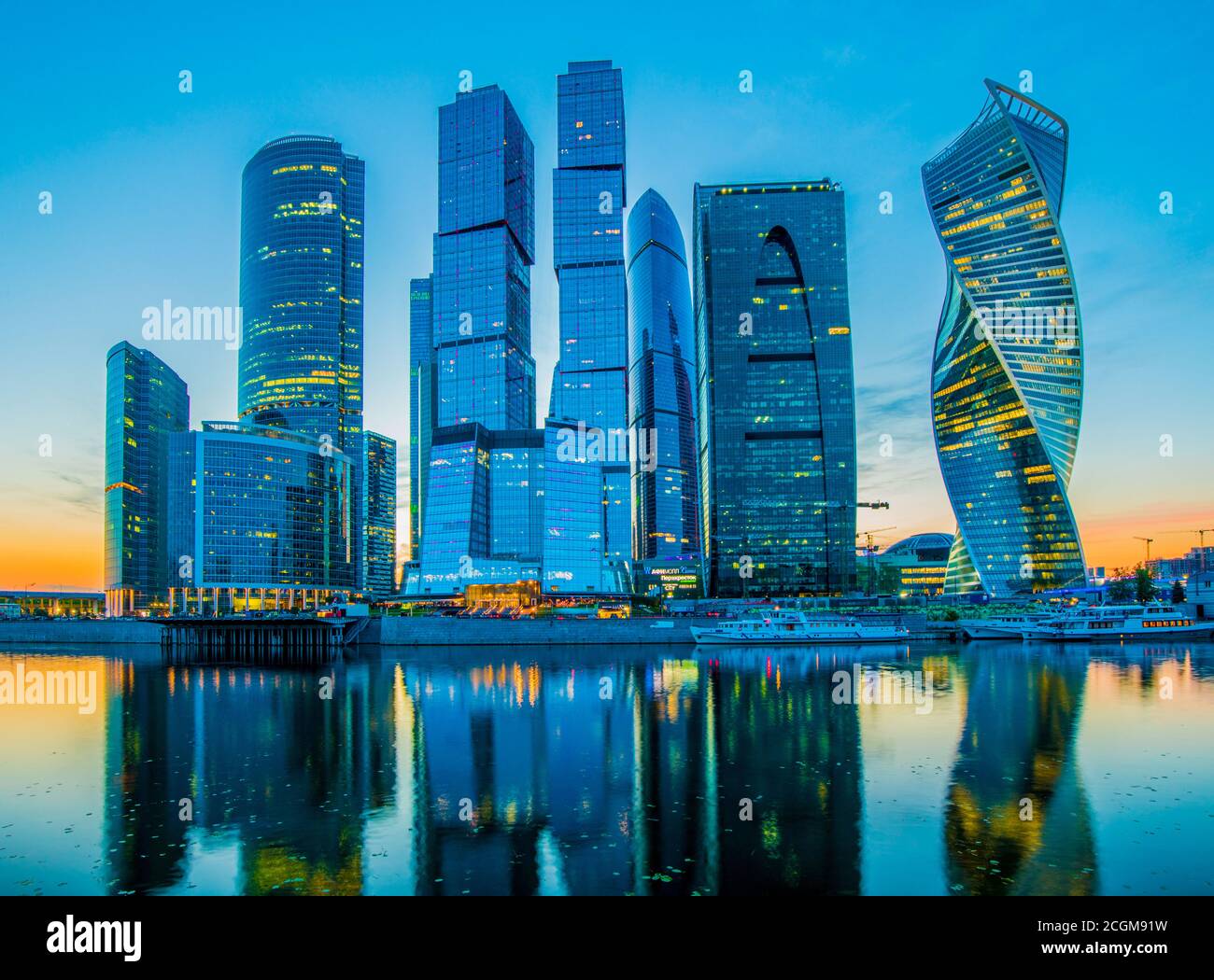 Moscow City, Russia skyline at sunset with reflection in the Moskva ...