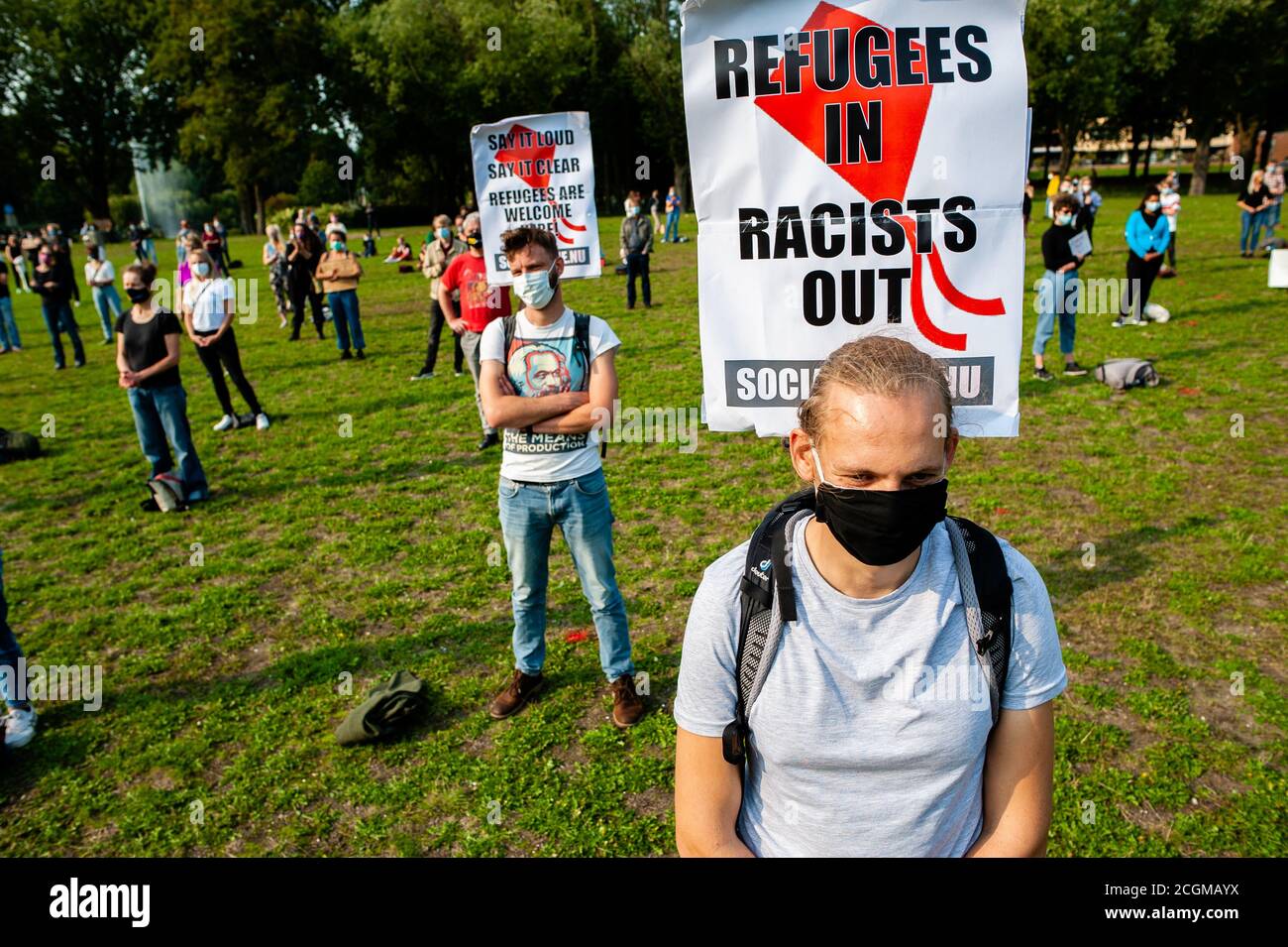 Men in masks take hi-res stock photography and images - Alamy