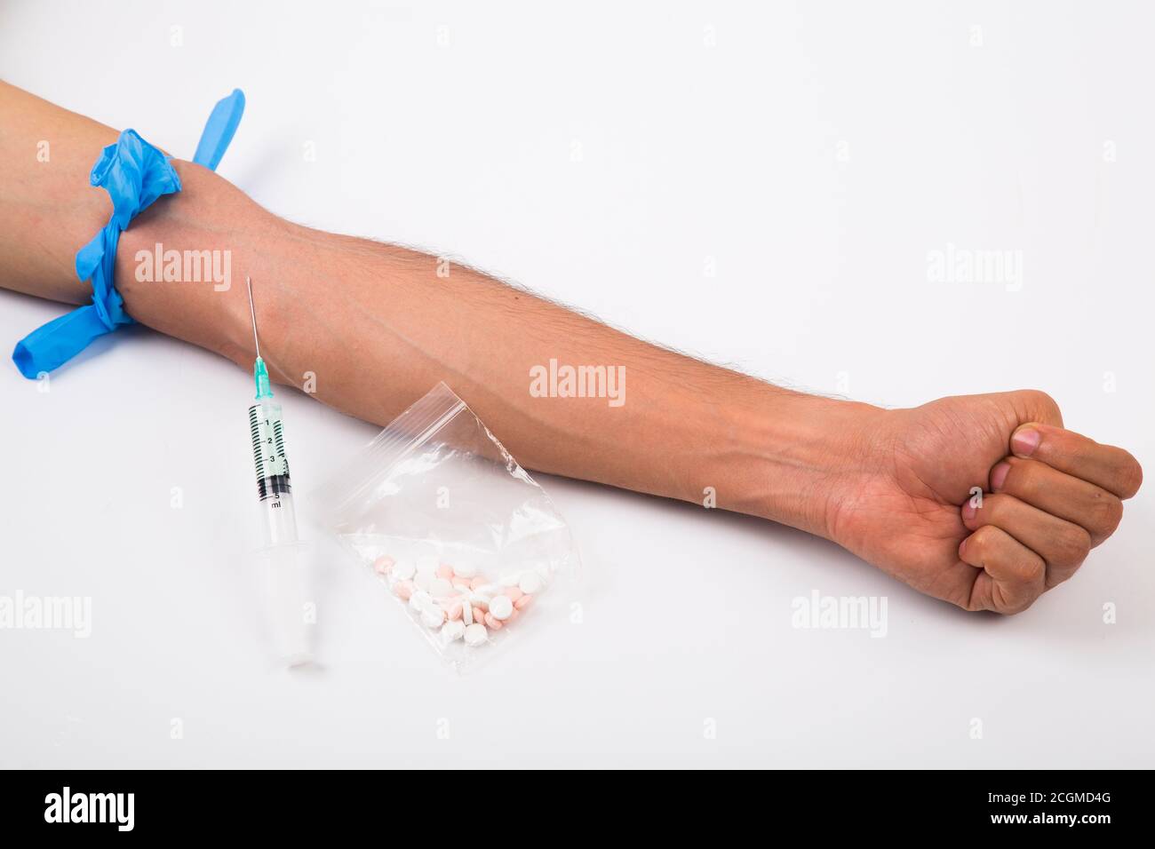 Drug addiction, male using drugs in syringe, white and isolated ...
