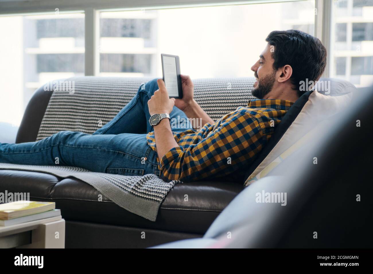 Home alone man reading hi-res stock photography and images - Alamy