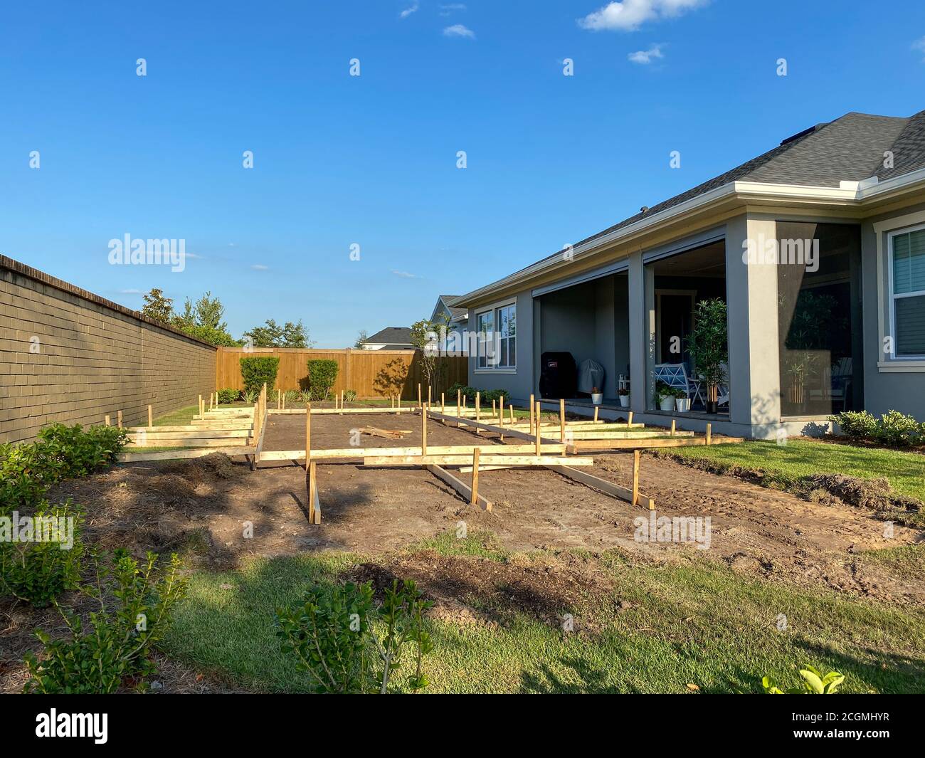A pool being built with the wooden stakes as to where the pool will be ...