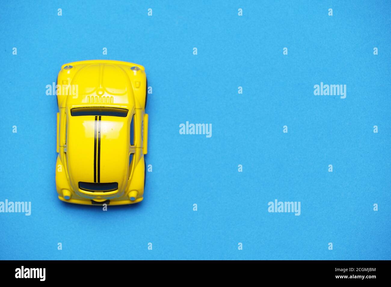 top view of yellow car on blue background. car travel concept. flat lay ...