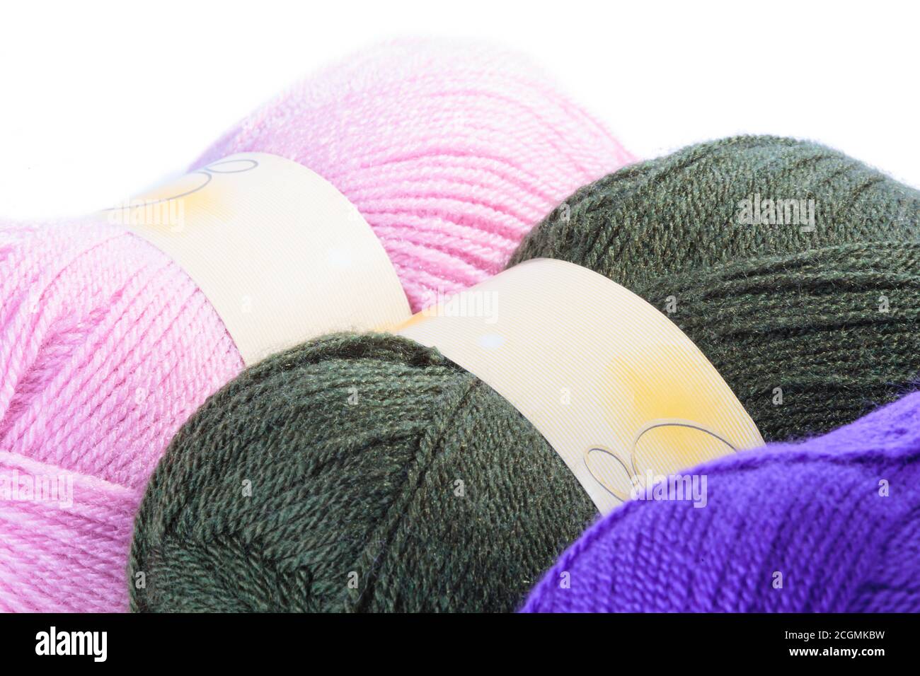 Three balls of coloured wool Stock Photo - Alamy