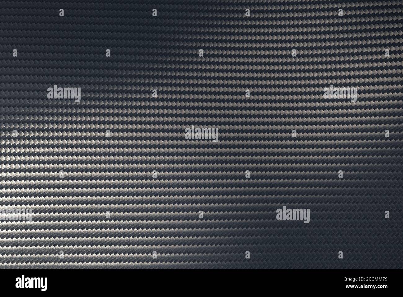 Light reflection on surface of grey woven carbon fibre composite ...