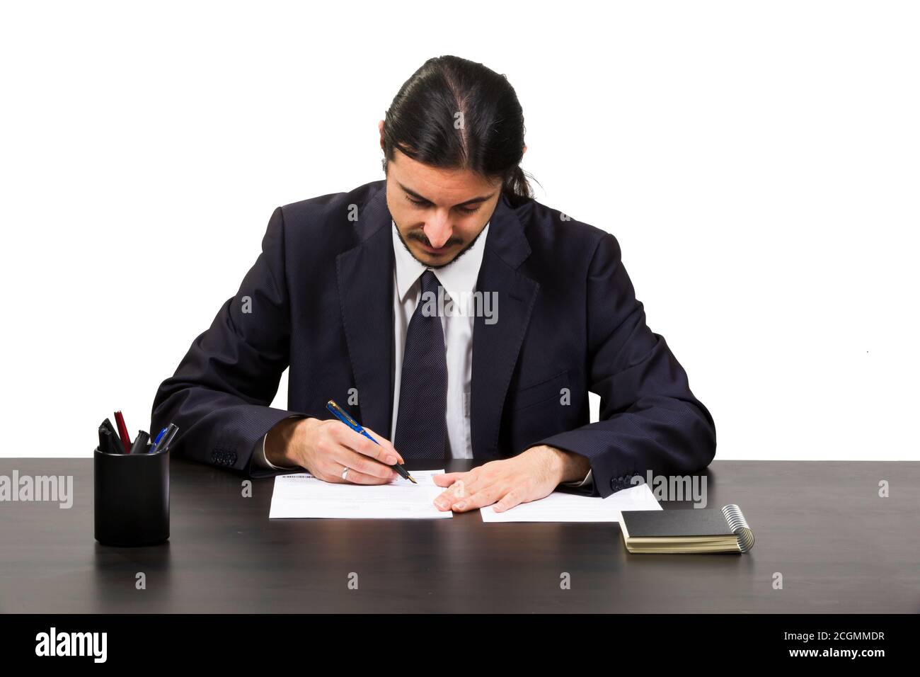 Serious Businessman Writing a Letter at his Desk Stock Photo - Alamy