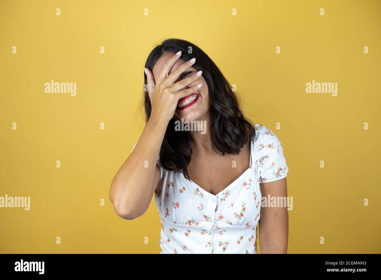 Hand over eyes peeking woman hi-res stock photography and images - Alamy