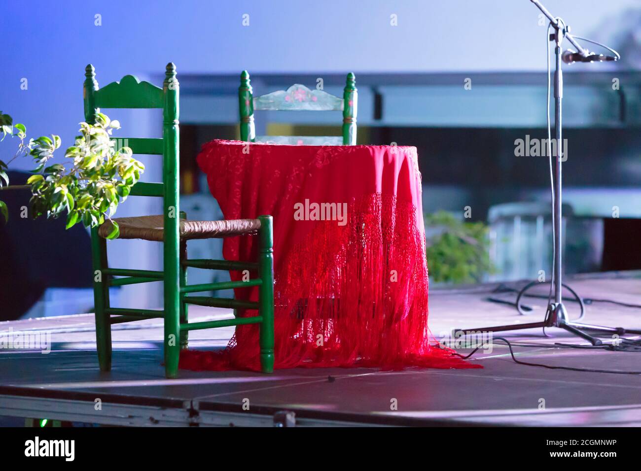 Colorful red flamenco shawl draped over a table Stock Photo - Alamy