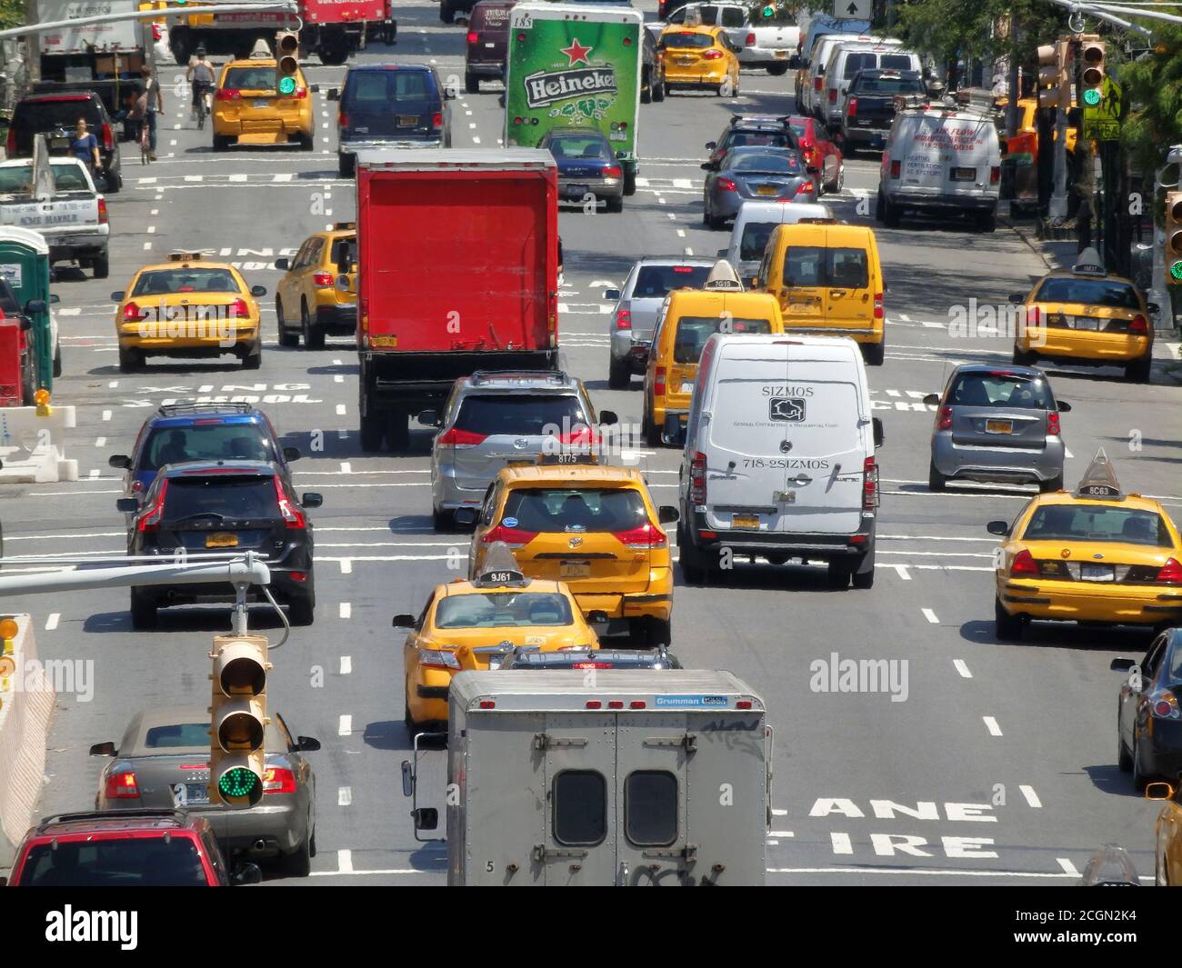 Traffic heading down a busy New York City street, United States Stock ...