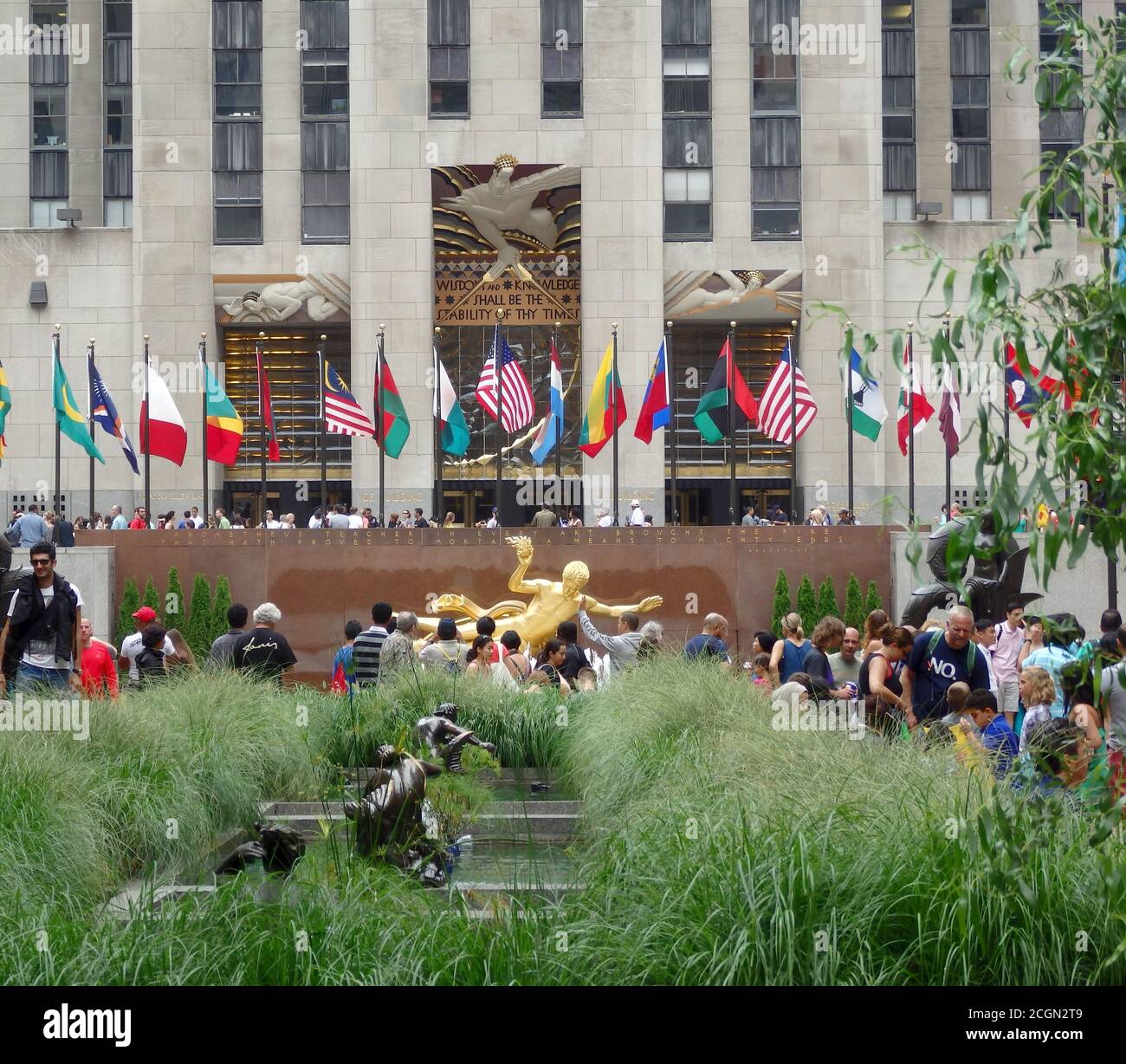 Prometheus statue and flags at Rockefeller Center, New York City ...