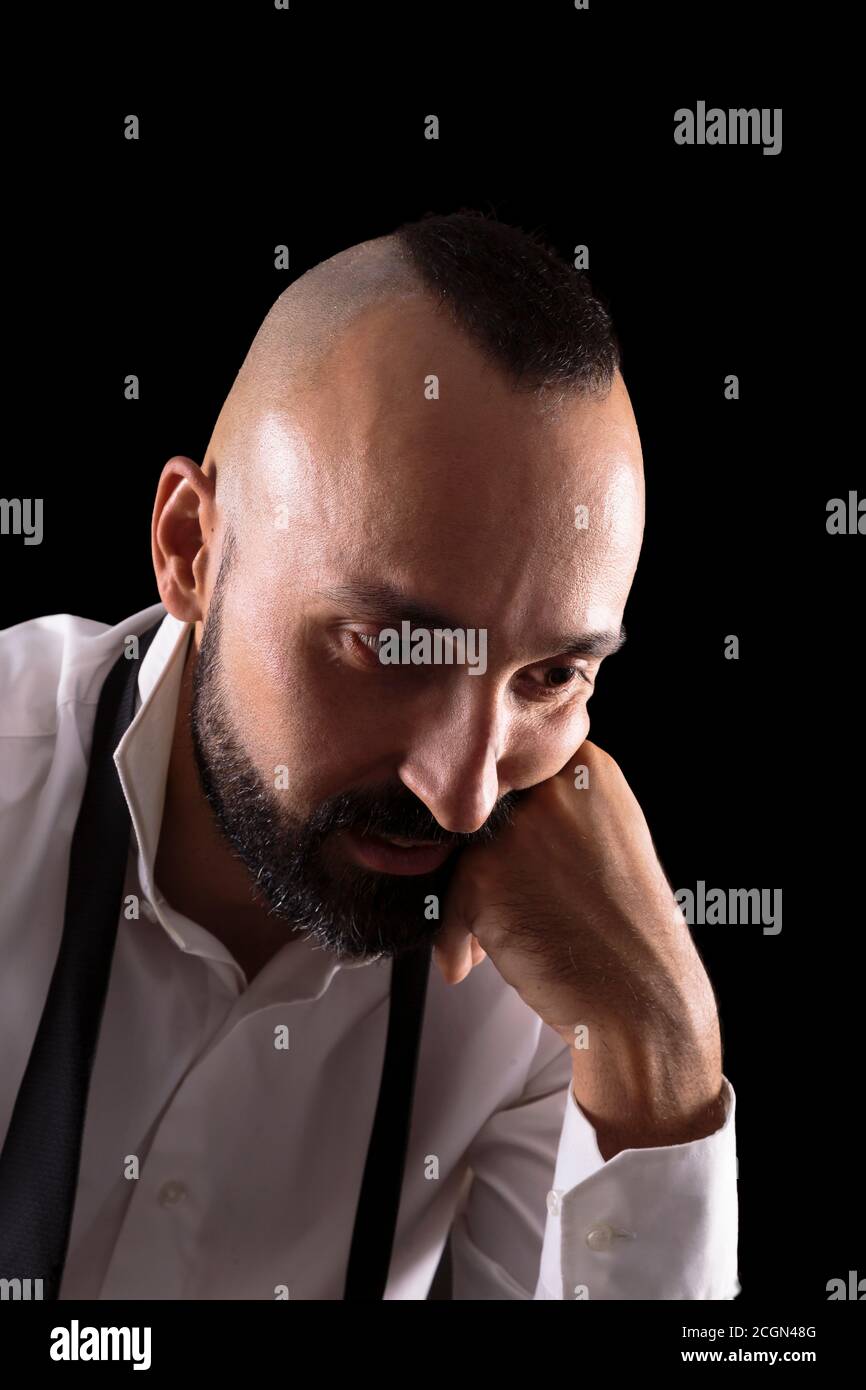 Portrait of a depressed young caucasian male looking down in ...