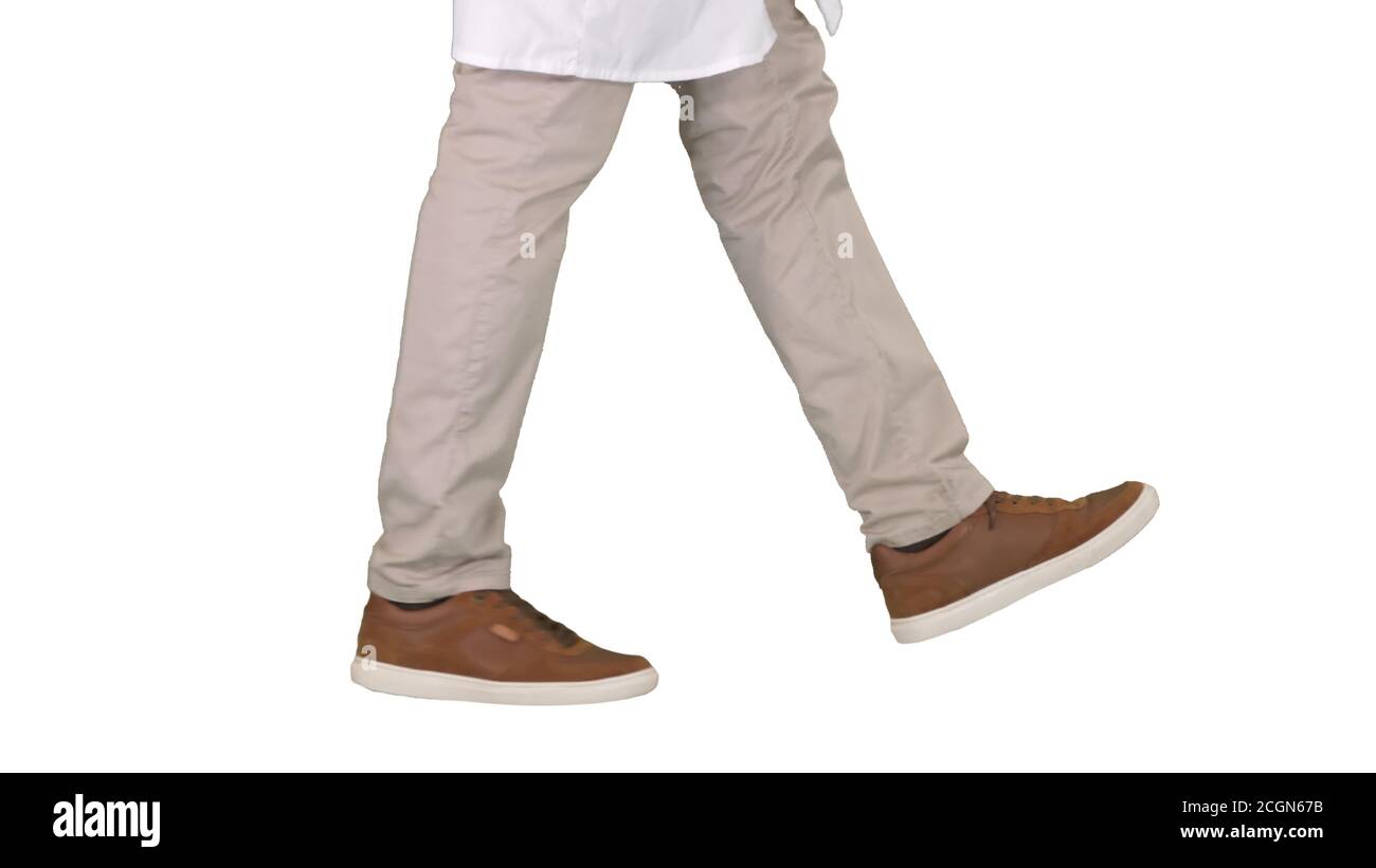Doctors legs walking on white background Stock Photo - Alamy