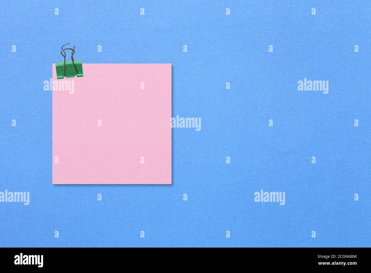 Colorful square note paper on blue paper background and have copy space ...